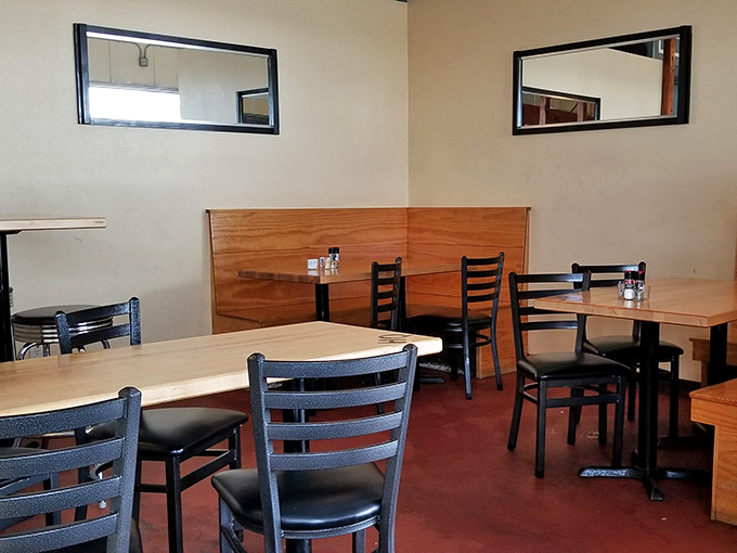Simple wooden tables and black chairs create the perfect no-nonsense setting where the food remains the undisputed star of the show.