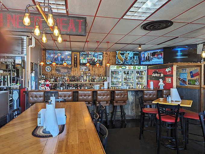 Edison bulbs cast a warm glow over leather-backed barstools and wooden tables&mdash;BBQ ambiance perfected without trying too hard.