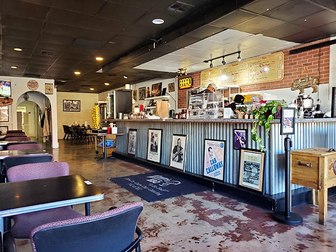 Inside Elmer's, the corrugated metal counter and brick walls create that perfect "focus-on-the-food" atmosphere that serious barbecue joints have mastered.