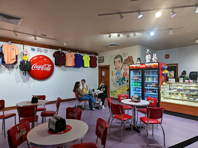 Retro Coca-Cola chairs and whimsical wall art create that perfect "remember when" atmosphere&mdash;nostalgia you can actually taste.