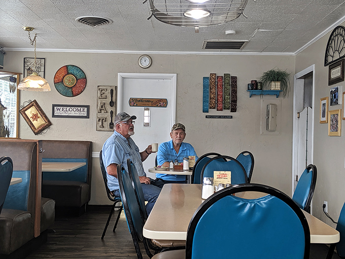 Inside, the cozy dining area feels like a living room where everyone's welcome. Those blue vinyl chairs have cradled generations of Twin Falls residents.