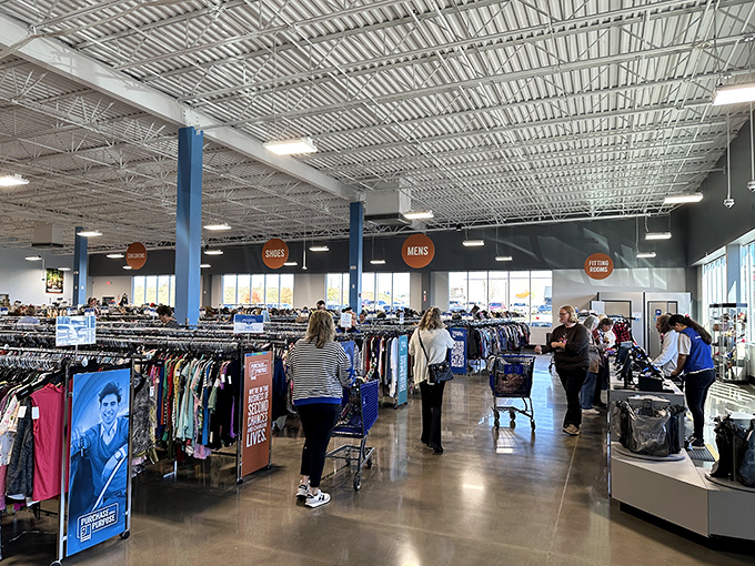 Treasure hunters navigate the expansive, well-organized interior where $30 can transform into a full wardrobe refresh.