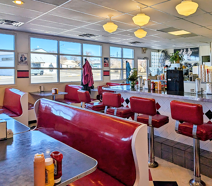 Cherry-red vinyl booths and vintage pendant lights create the perfect backdrop for making memories over milkshakes.