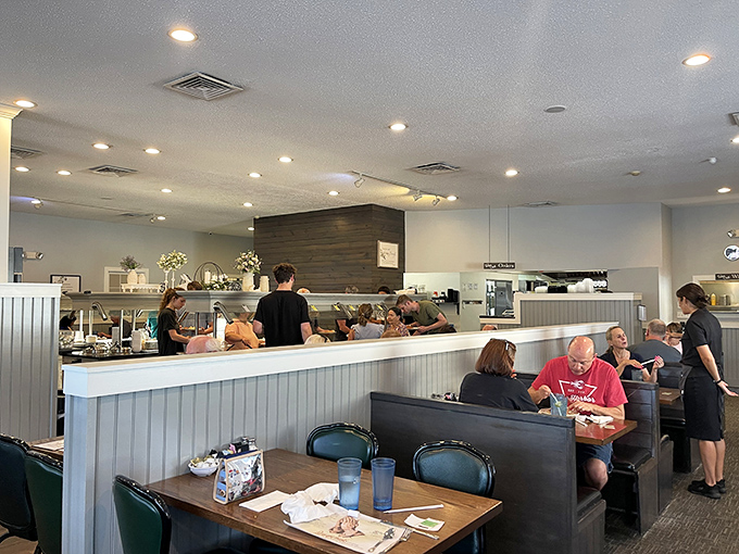 Inside, the clean, bright dining room buzzes with anticipation as diners strategize their buffet approach &ndash; a serious business when every dish demands attention.