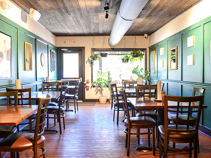 Step inside to a warm embrace of wood-paneled ceilings, teal wainscoting, and hanging plants&mdash;like dining in your coolest friend's renovated farmhouse.