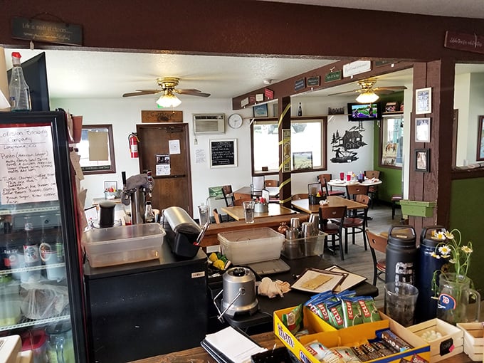 The definition of cozy mountain charm &ndash; wooden tables, fishing memorabilia, and the unmistakable aroma of coffee that makes you want to settle in for the morning.