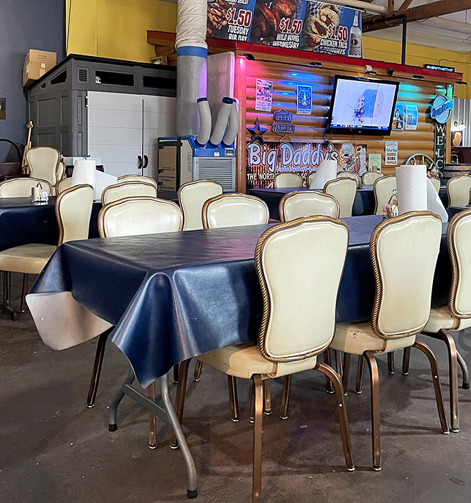 Cream-colored chairs await hungry patrons beneath log cabin walls&mdash;a dining room where Southern comfort meets Northern hospitality.