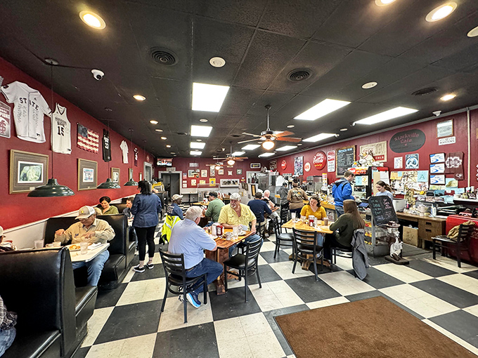 Inside, the walls tell stories of local pride while the checkered floor keeps time with decades of satisfied footsteps.