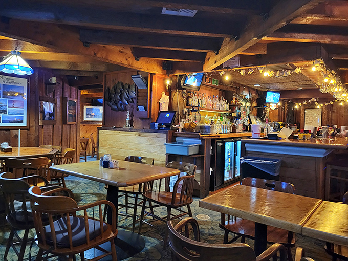 Step inside and you're transported to a cozy wooden haven where the warm glow of string lights promises memorable meals and conversation.