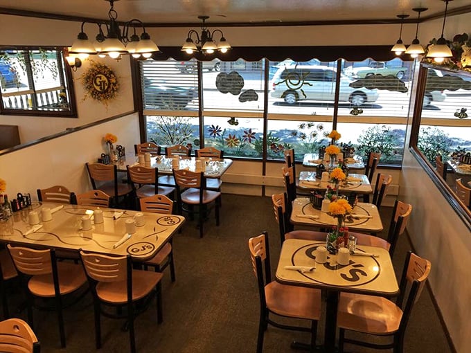 Inside GJ's, wooden tables adorned with the restaurant's logo create that perfect diner atmosphere &ndash; unpretentious, welcoming, and ready for serious eating business.