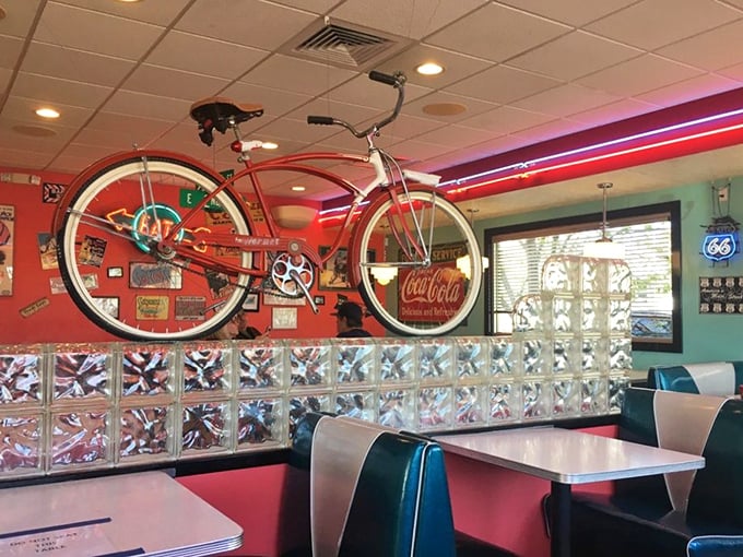 That suspended bicycle isn't going anywhere&mdash;except perhaps back in time, floating above diners amid classic Coca-Cola memorabilia.