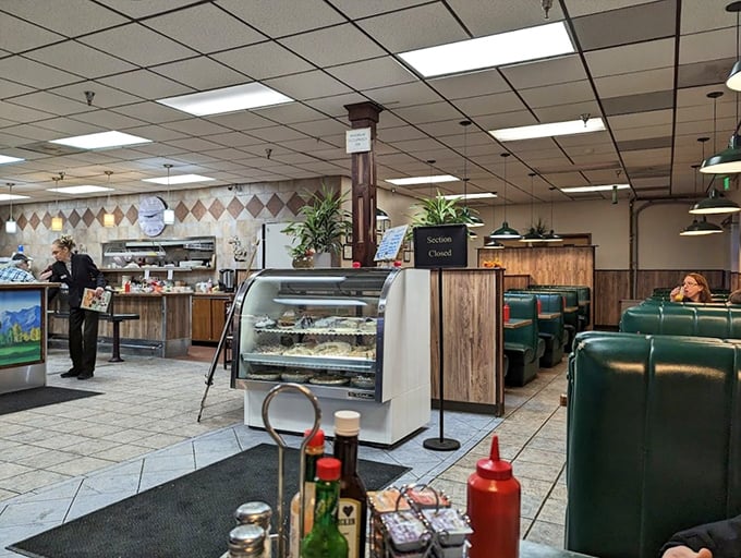 Classic diner aesthetics with green vinyl booths and wooden accents create that timeless "I could sit here all day" atmosphere locals cherish.