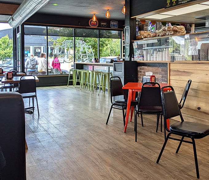 Industrial-chic meets comfort food haven. Those lime green stools aren't just for show&mdash;they're front-row seats to the culinary main event.