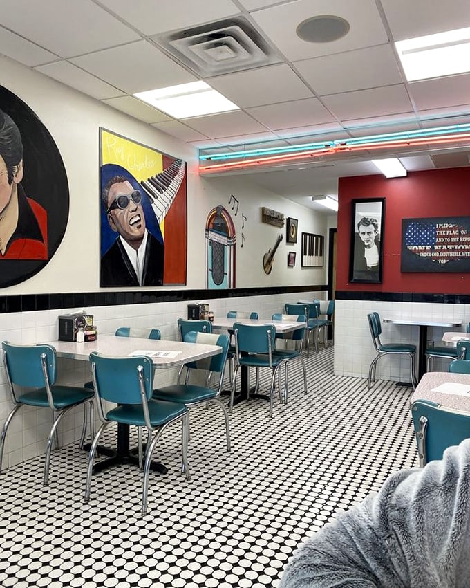 Step inside and the 1950s never ended—turquoise chairs, checkered floors, and musical legends watching over your meal like old friends catching up.