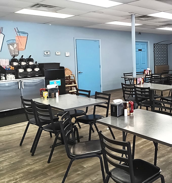 Simple, clean, and ready for business. The light blue walls and no-nonsense seating tell you immediately: this place prioritizes what's on your plate, not what's on their walls.