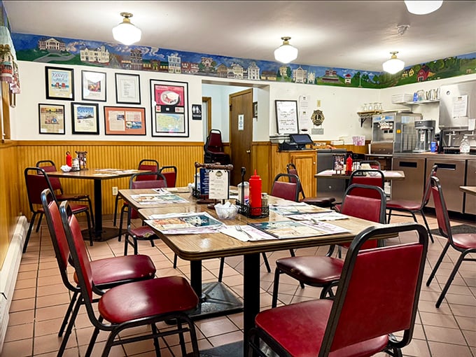 Step inside where red seats and tile floors create that authentic diner atmosphere that modern restaurants spend fortunes trying to replicate.