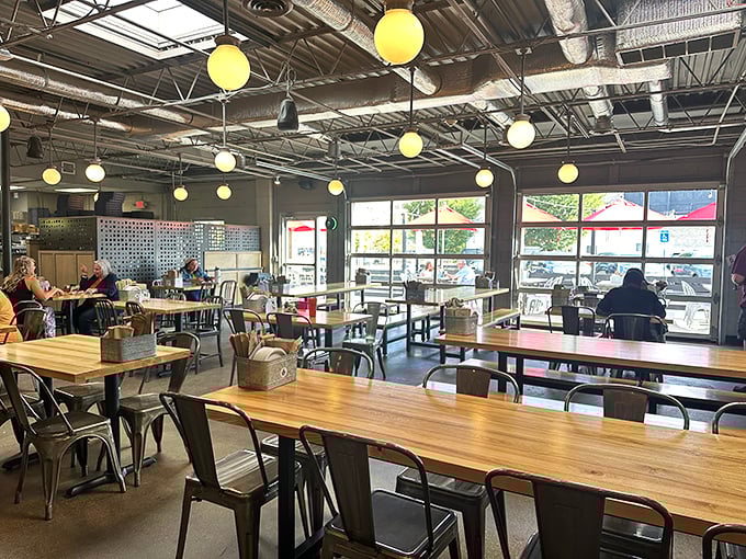 Industrial-chic meets warm hospitality in this dining room where strangers become friends over shared tables and shared pizza passions.
