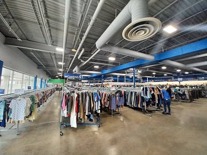 Endless racks stretch toward industrial ceilings like a fashion forest. The women's section alone could clothe a small town for pennies per outfit.