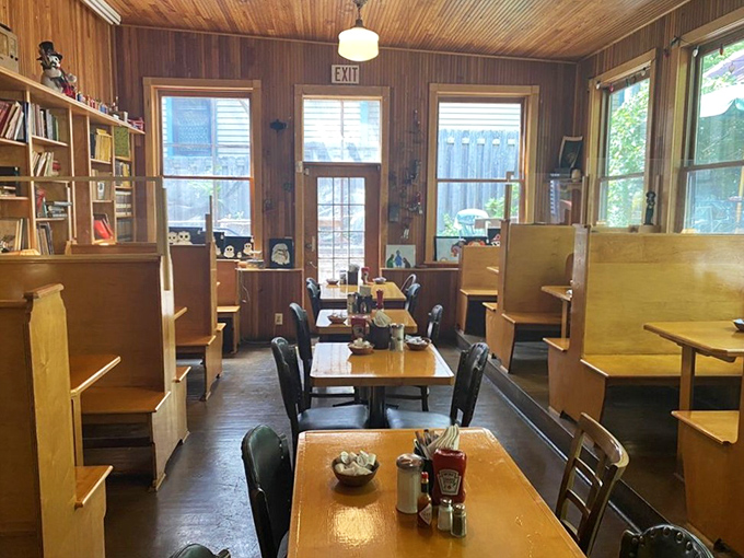 Wooden booths and paneling create that rare atmosphere where you instantly feel like a regular, even on your first visit.