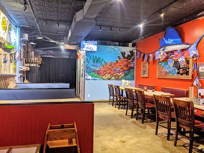 Vibrant orange walls and underwater murals transport you from cornfield country to coastal getaway the moment you step inside.