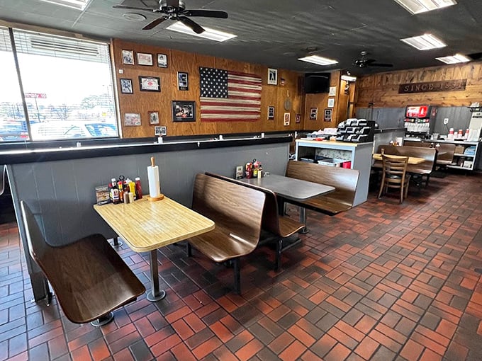 The wood-paneled walls and American flag create an atmosphere where comfort food feels like a warm Southern hug.