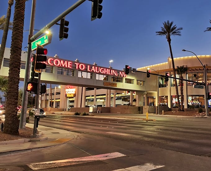"Welcome to Laughlin, NV" - where this illuminated gateway promises desert adventures with a side of air conditioning.