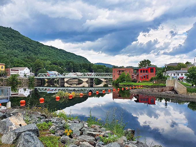 Mother Nature and small-town ingenuity shake hands across the Deerfield River, creating a postcard moment that no filter could improve.