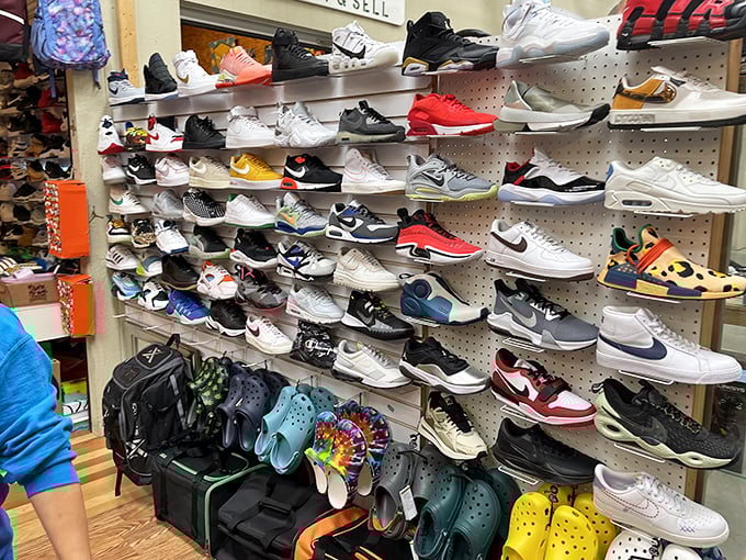 Sneakerheads, rejoice! This wall of footwear fashion spans decades of athletic style, from vintage classics to contemporary kicks waiting for their forever homes.