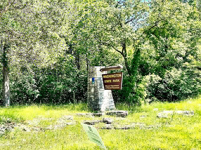 Like a stone sentinel guarding a natural treasure, this rustic entrance sign welcomes visitors to a world where modern stress dissolves into ancient Ozark wilderness.