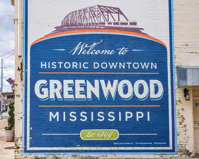 This vibrant mural welcomes visitors to Greenwood's historic downtown, established long before streaming services or smartphone payments existed.