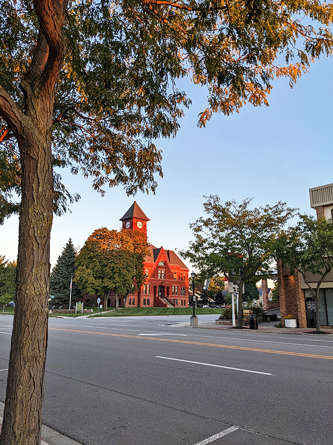 The historic red-brick courthouse glows at sunset like it's auditioning for a starring role in a small-town romance movie. No filter needed on this Michigan masterpiece.