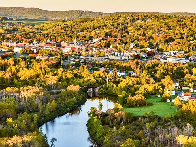 Fort Kent's golden autumn glow reflects off the river, painting a picture worth a thousand words&mdash;but costing far fewer dollars to enjoy daily.