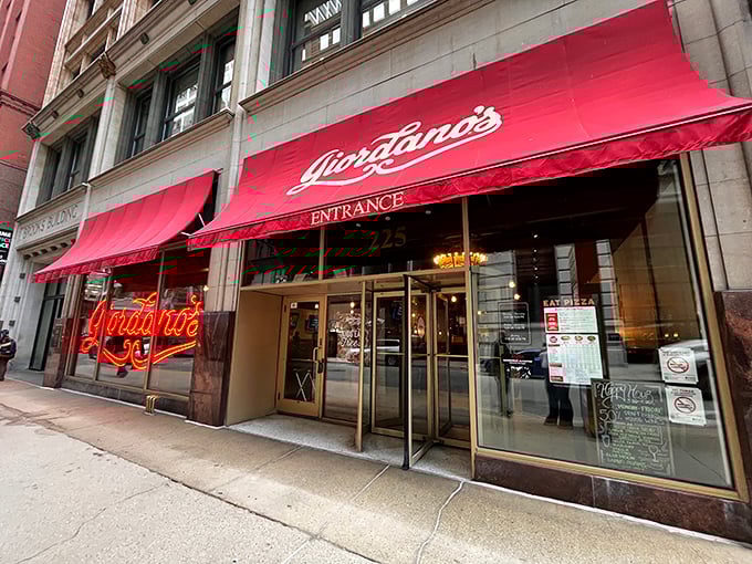 Giordano's iconic red awning signals you've arrived at deep dish heaven. The entrance is your gateway to cheese-pull paradise.