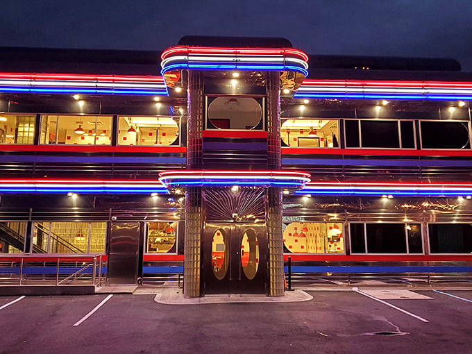 Goobers Diner glows like a time machine after dark. This chrome palace isn't just a restaurant; it's a 1950s dream with a side of fries.