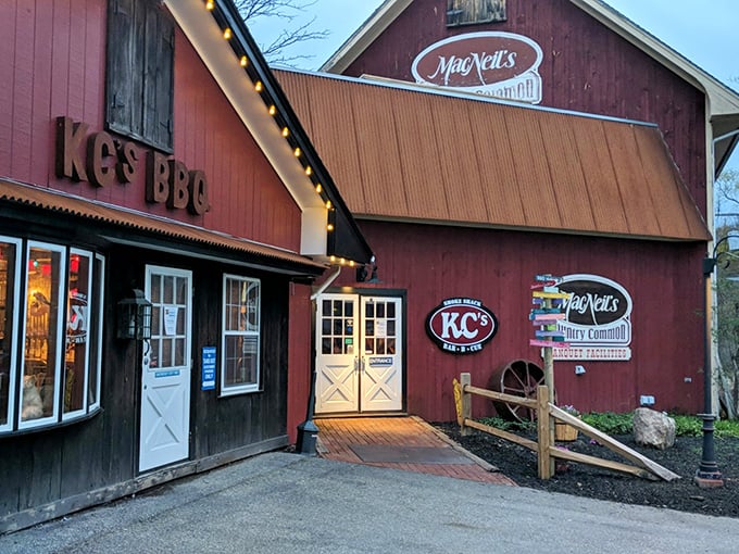 KC's Rib Shack nestled in its barn-red building. Where BBQ dreams and elastic waistbands come together in perfect harmony.