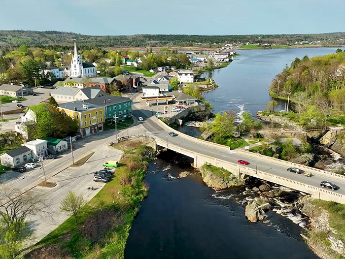 A bird's eye view reveals the perfect marriage of river and town, where colorful buildings cluster around the flowing water.