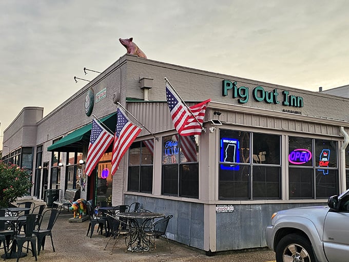 American flags wave you into Pig Out Inn, where patriotism and perfect brisket live in delicious harmony.