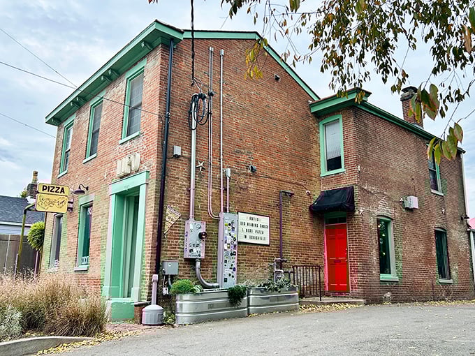 Pizza Lupo's charming brick exterior with mint-green accents looks like it was plucked from a storybook about perfect neighborhood eateries.