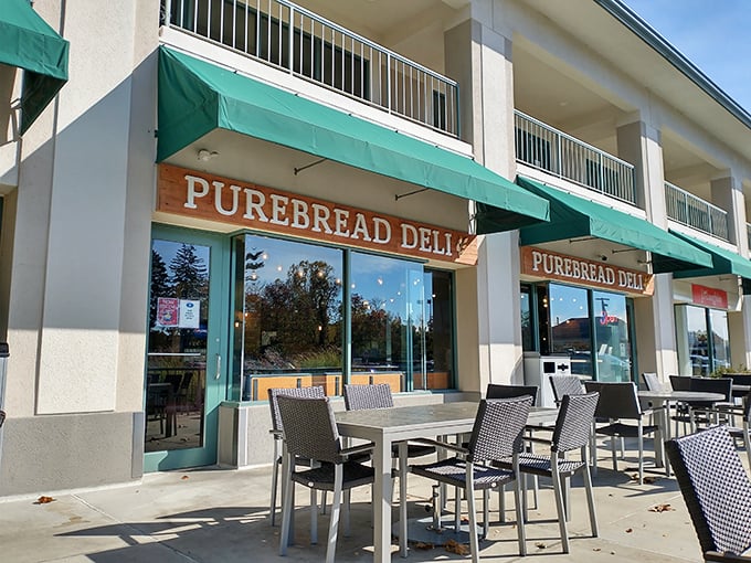 PureBread's modern storefront with teal awnings promises a sandwich experience that's several notches above your sad desk lunch.