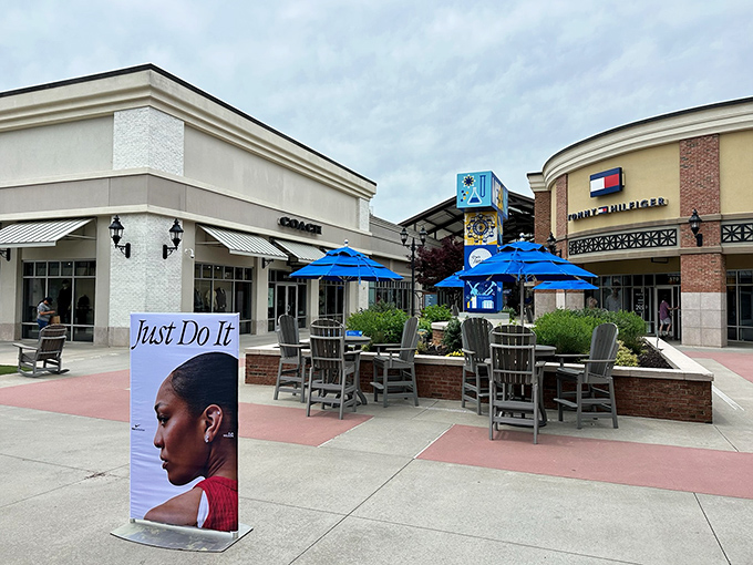 Blue umbrellas offer shoppers a shady respite at Tanger Outlets Mebane. Nothing says "take a break" like comfortable seating between bargain-hunting adventures!
