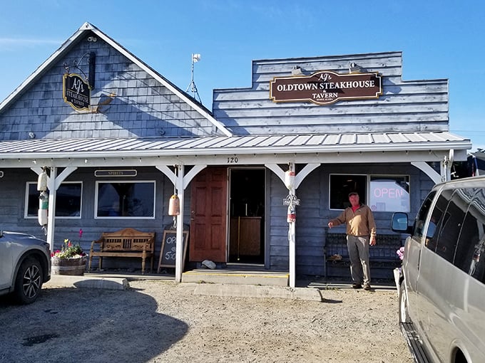 That covered porch practically begs you to sit a spell before diving into some serious Alaska steaks.