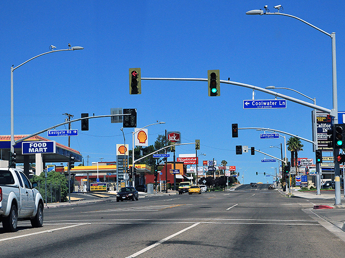 Traffic lights punctuate Barstow's main drag, where Route 66 nostalgia meets desert practicality and budget-friendly living.