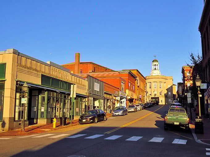 The golden hour bathes Bath's historic downtown in warm light, highlighting the classic New England architecture that gives this city its timeless appeal.