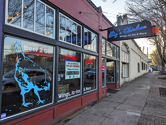 Blue chicken silhouette, red walls, and the promise of wings. Big's exterior is as bold as its flavors.