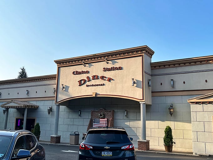 Morning light reveals Clinton Station Diner's welcoming facade – where omelets are fluffy, coffee is bottomless, and nobody rushes you.