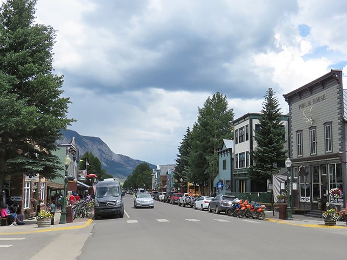 Small-town charm flows down this peaceful avenue where mountains provide the ultimate scenic backdrop.