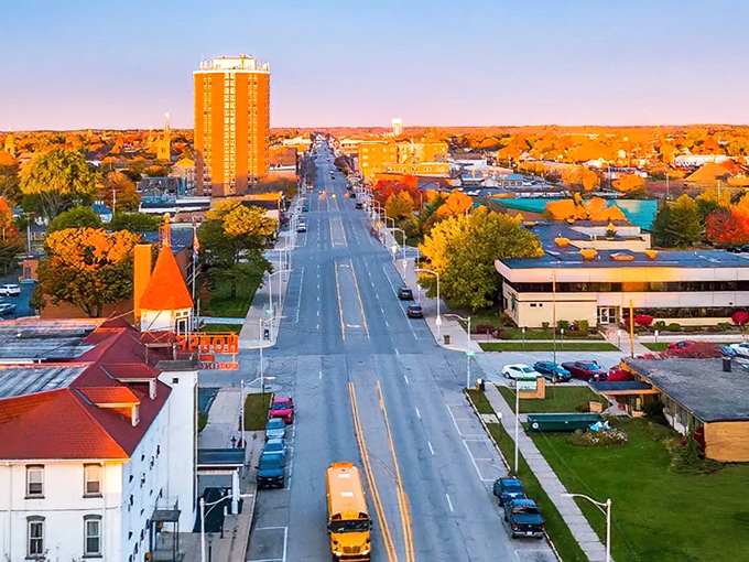 Downtown Escanaba stretches toward the horizon, a testament to small-town affordability wrapped in autumn's golden embrace.