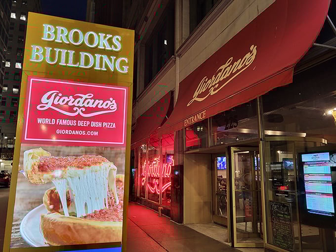 The Brooks Building houses a Chicago pizza institution. That glowing sign is like a lighthouse for hungry travelers.