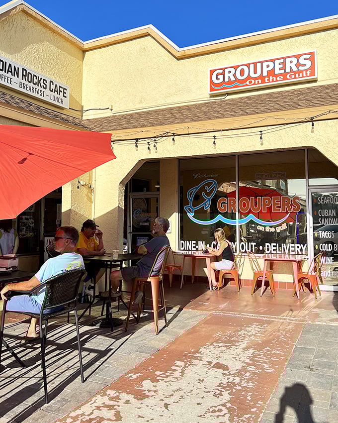 The outdoor patio at Groupers invites you to savor Florida's finest catch while soaking up that perfect beach vibe.