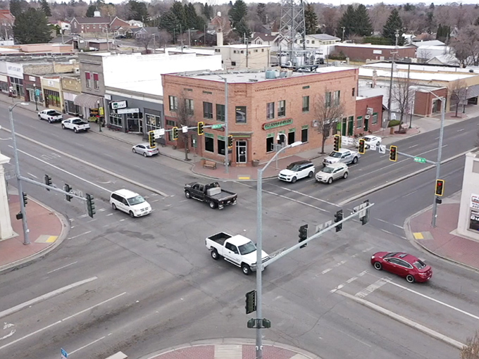 Small-town intersections where traffic lights feel more like friendly suggestions than urgent demands.